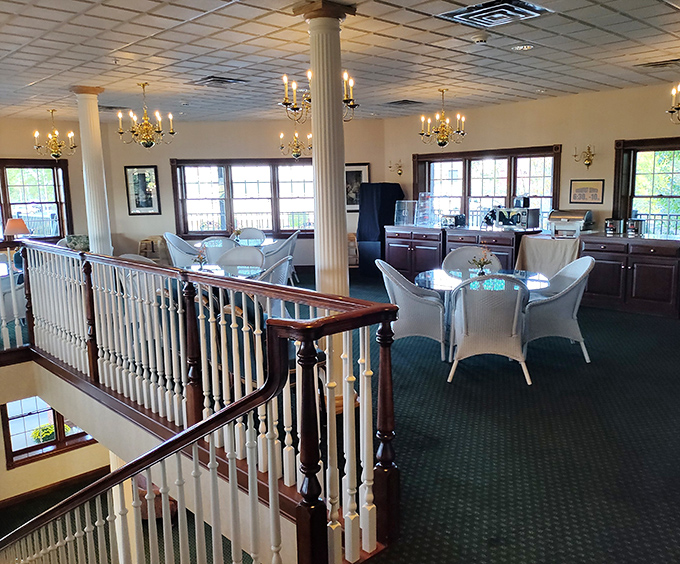 Upstairs dining area with elegant touches proves comfort food can dress up when it wants to. Those chandeliers have seen some serious eating.