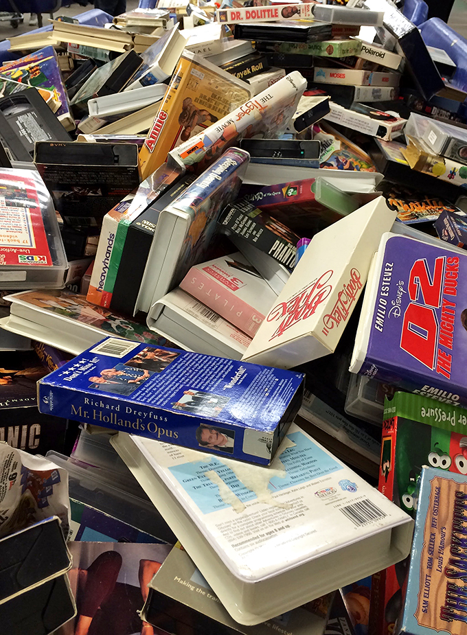 Literary roulette in physical form. Somewhere in this pile is the exact paperback you didn't know you needed until this moment.