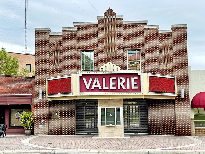 The Valerie Theatre's classic marquee glows with vintage charm &ndash; a reminder that entertainment doesn't require 3D glasses or subscription streaming services.