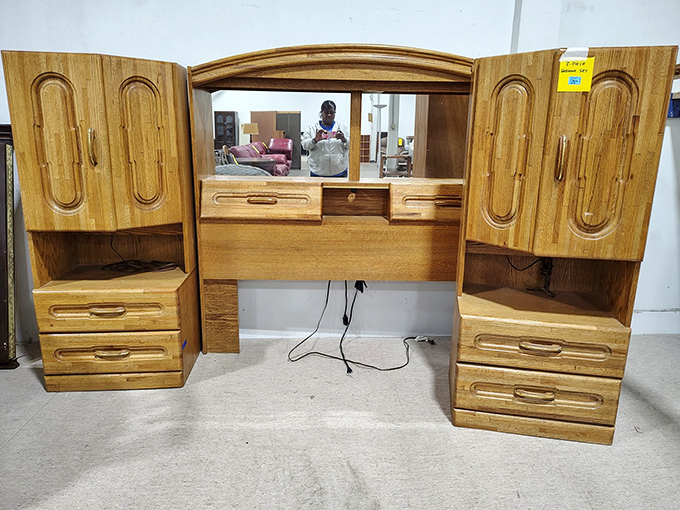 This vintage vanity cabinet whispers tales of morning routines from decades past&mdash;solid wood craftsmanship that's outlasted three generations of flimsy furniture fads.