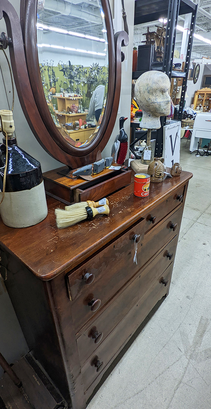 An antique vanity complete with oval mirror &ndash; where countless morning routines and evening preparations took place.