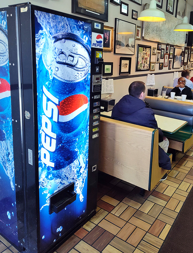 Even the Pepsi machine looks like it belongs in this time capsule of American dining, standing sentinel beside booths of hungry patrons.