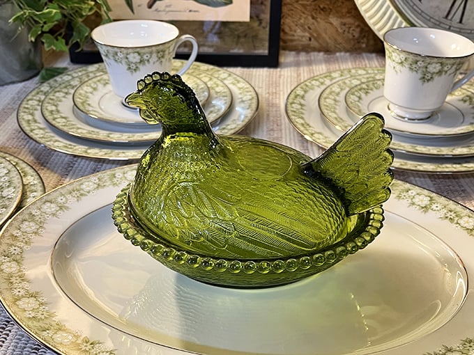 This emerald glass chicken dish once proudly held deviled eggs at church potlucks and holiday gatherings before roosting here among the collectibles.