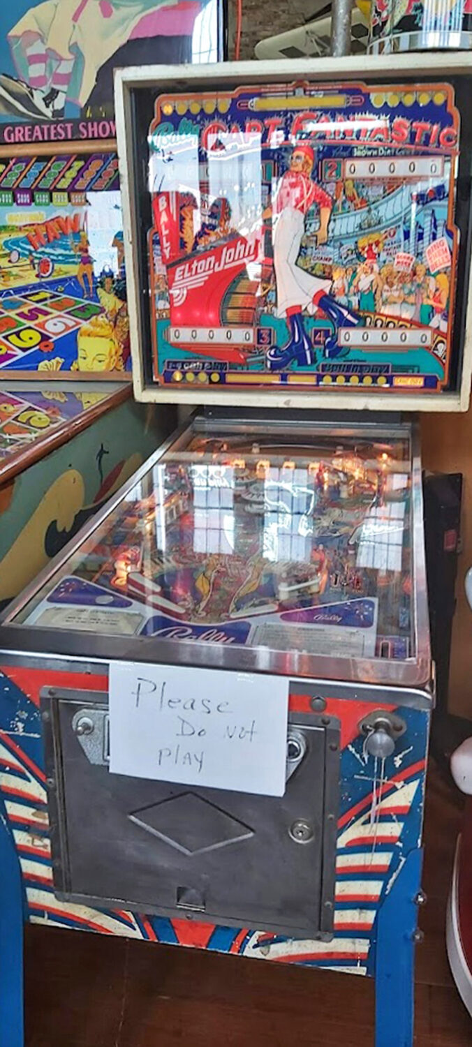 Vintage pinball machines with their "Please Do Not Play" signs&mdash;the ultimate temptation for fingers that remember the thrill of the flippers.