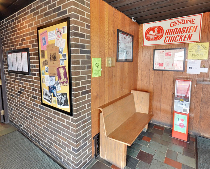 The waiting area's wooden bench has supported countless hungry patrons, all united by the universal language of pizza anticipation.