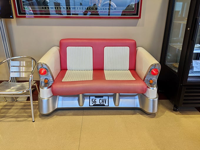 Even the waiting area channels automotive nostalgia with this clever car-seat bench&mdash;proof that at Tin Goose, style never takes a backseat to substance.