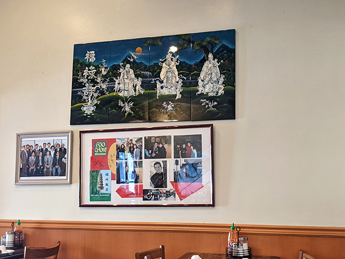 The wall displays proudly showcase the restaurant's cultural heritage and famous visitors. Each frame tells a story of tradition and celebrity encounters.