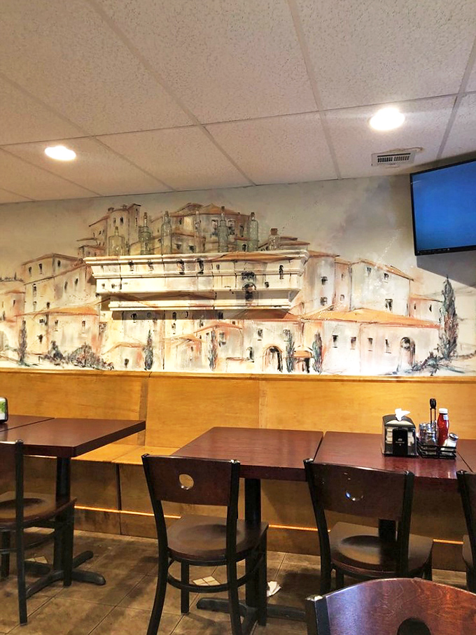 That hillside village mural makes you feel like you're dining in Tuscany, minus the jet lag.