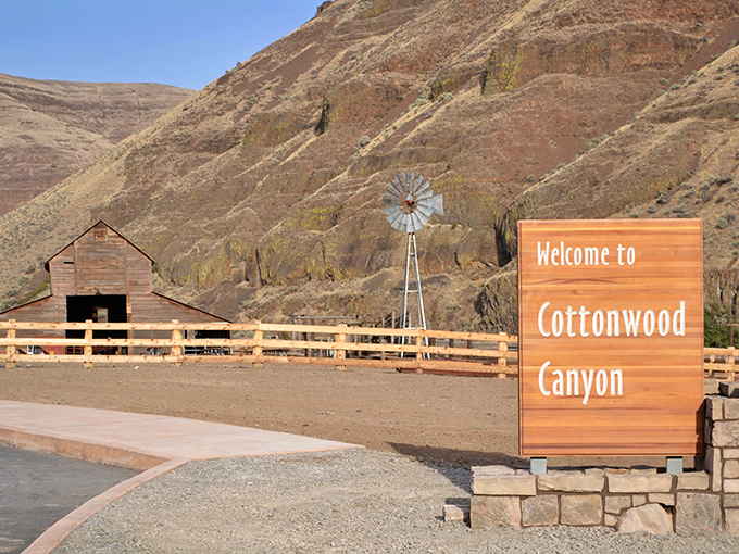 The welcome sign and historic barn greet visitors like old friends, saying "slow down, you've got nowhere better to be."
