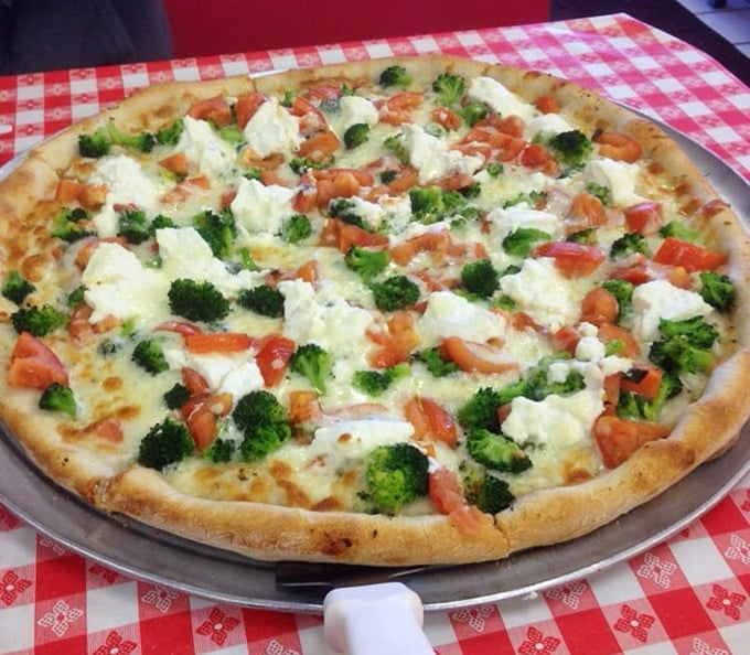 This white pizza with broccoli and tomatoes proves vegetables on pizza aren't just virtuous&mdash;they're downright decadent when paired with the right cheese and crust.
