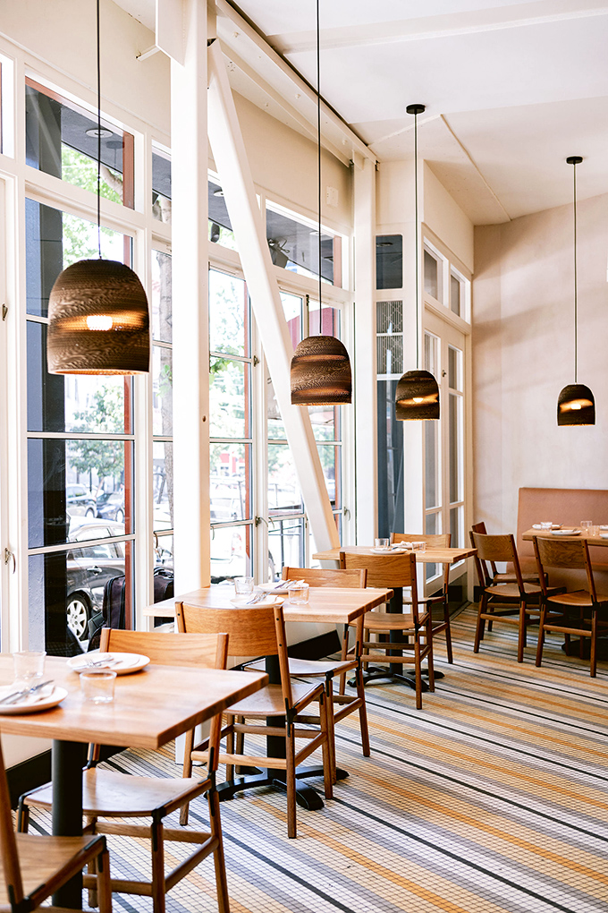 Natural light floods this dining space, making everything look Instagram-worthy while you're actually just trying to eat peacefully.