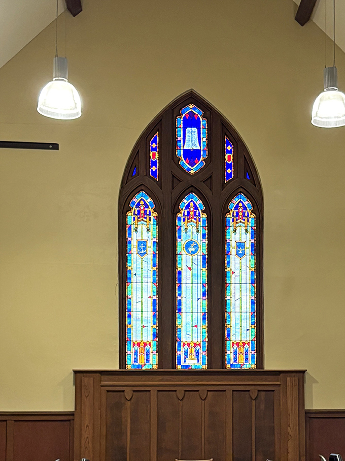Stained glass windows bathe the space in colored light, as if even the sun wants to dress up for these baked goods.