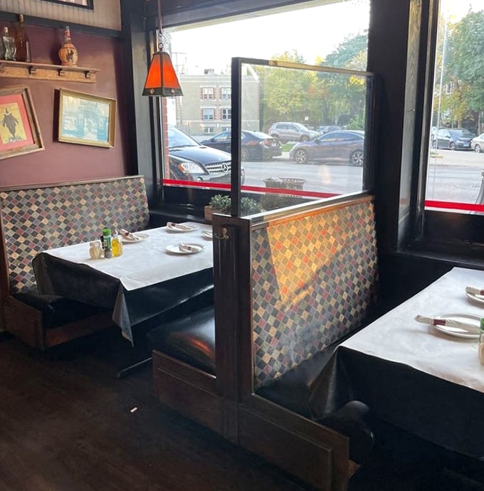 Window-side tables offer prime people-watching real estate while you contemplate whether to order one more slice or save room for tiramisu.