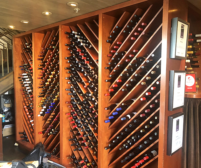 A wine collection displayed with the reverence of a library and the excitement of a treasure map &ndash; each bottle a potential adventure.