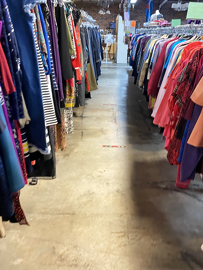 Rainbow racks of women's clothing stretch into the distance, a technicolor dream coat of possibilities for every style and occasion.
