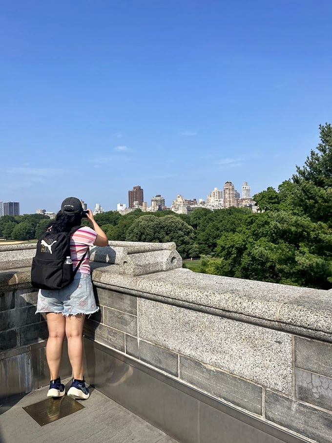 Photographer's paradise. The castle's stone terrace offers the perfect vantage point for capturing Manhattan's impressive skyline beyond the park's green canopy.