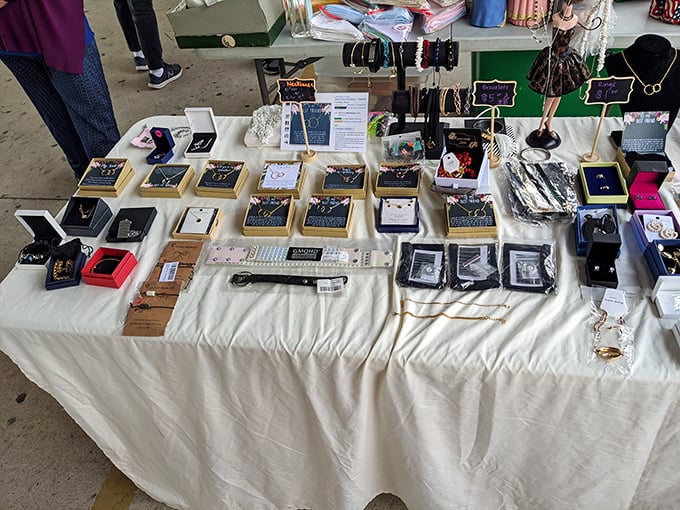 Jewelry displays transform ordinary tables into treasure chests, where one person's craftsmanship becomes another's statement piece.