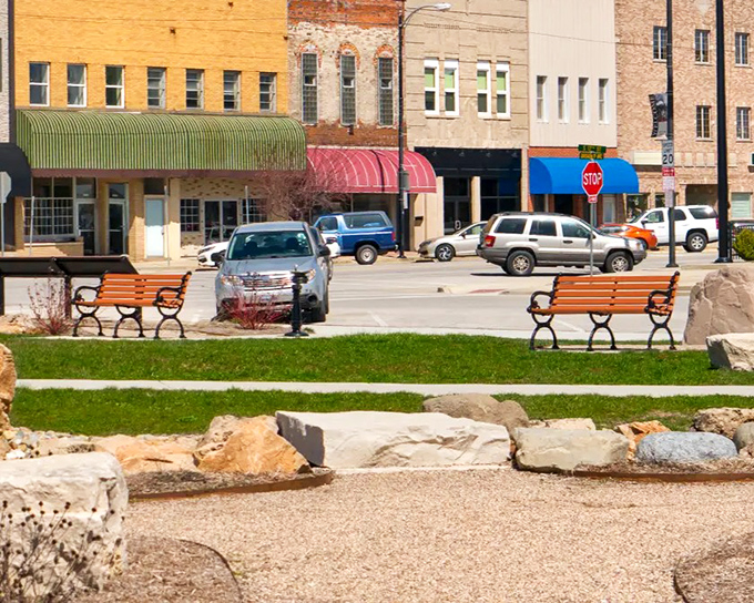 Colorful awnings along Broadway Avenue protect window shoppers from both sun and impulse purchases, adding vibrant notes to the streetscape.
