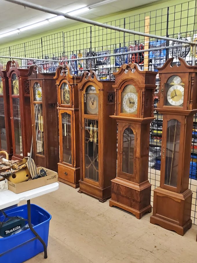 Grandfather clocks stand like wise sentinels of a bygone era, their pendulums ready to swing back into service in some lucky buyer's home.