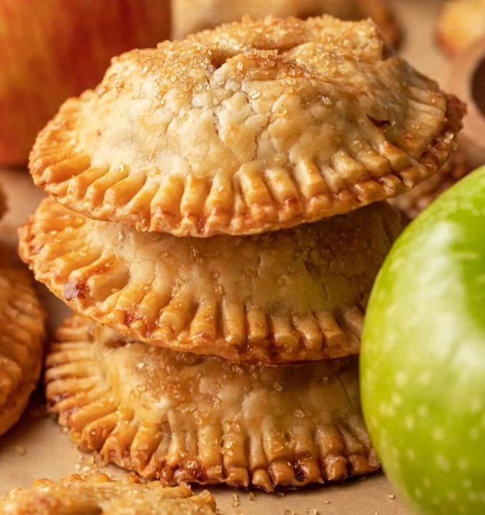 Hand pies stacked like golden treasures&mdash;portable pastry perfection that fits in your palm but expands in your heart.