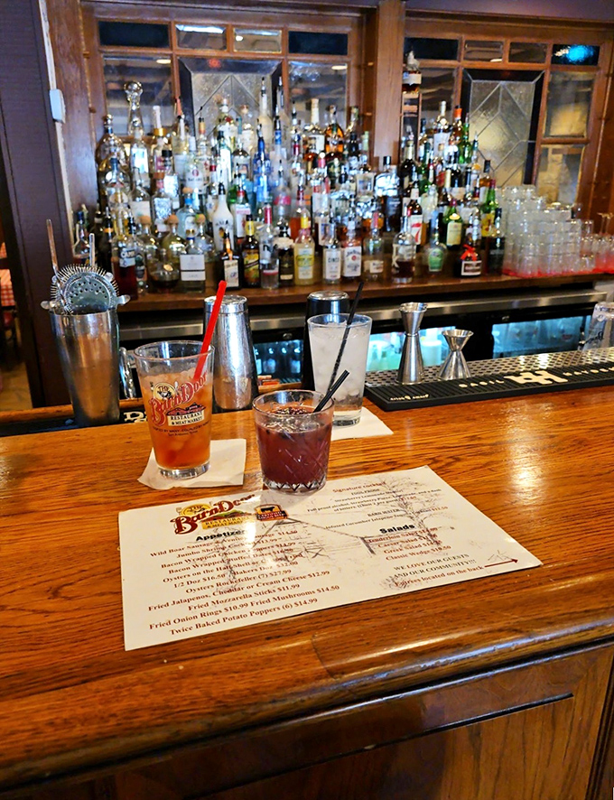 Sometimes the best seat in the house is at the bar with a well-made cocktail and the menu spread before you.