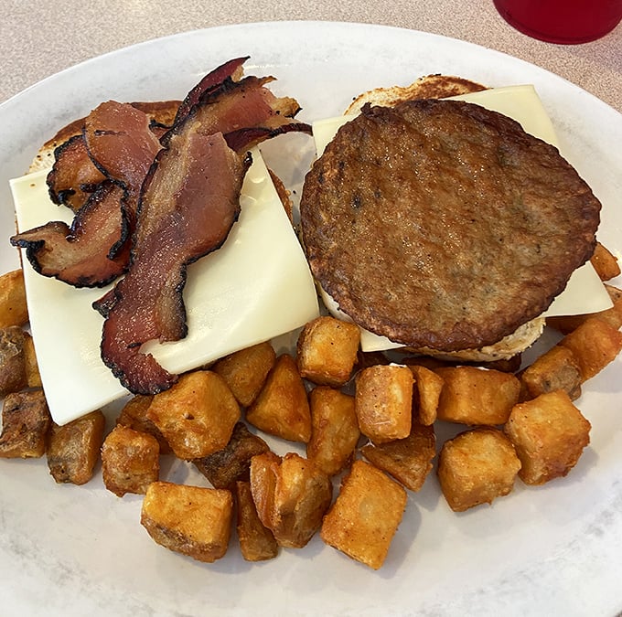 A proper diner burger doesn't need truffle aioli or artisanal buns&mdash;just quality beef, melty cheese, crispy bacon, and those golden home fries.
