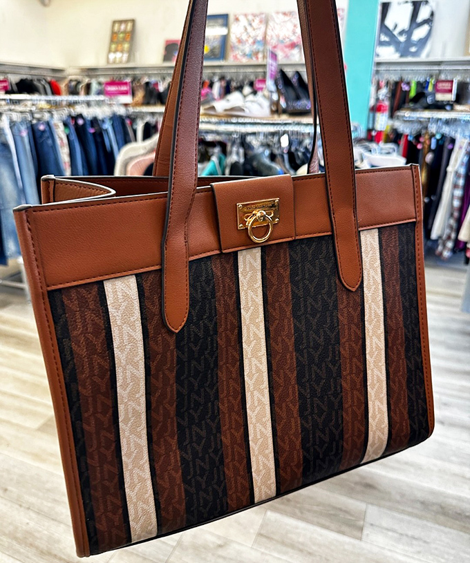 Designer bags at thrift store prices – the holy grail of secondhand shopping captured in one perfectly structured tote.