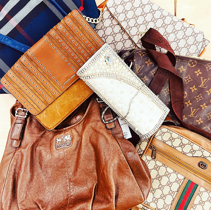 Designer heaven! This collection of luxury handbags proves that high-end treasures hide in thrift store display cases.