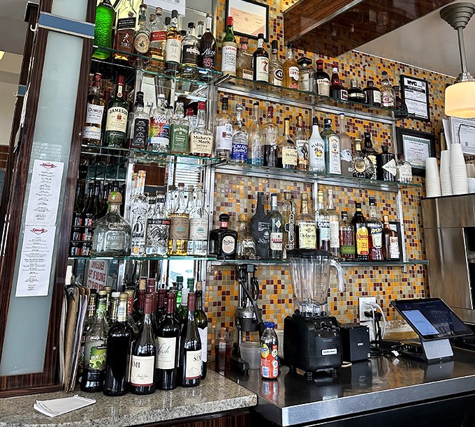 Behind the bar, bottles stand at attention like soldiers guarding the sacred tradition of the boozy weekend brunch. Mimosa, anyone?