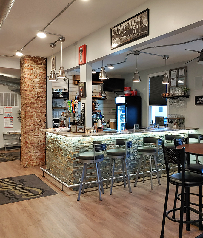 The stone-accented bar combines rustic charm with modern touches, creating the perfect perch for tenderloin appreciation sessions.