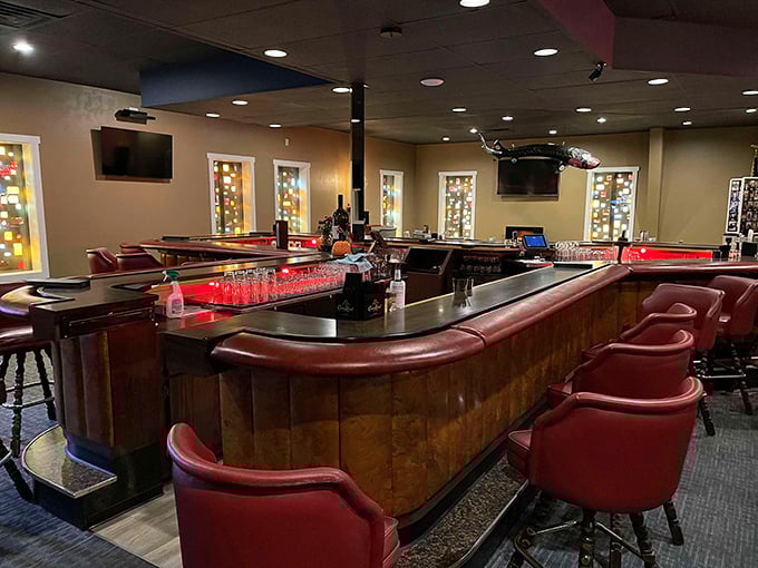 A classic horseshoe bar with plush red seats &ndash; where strangers become friends and the perfect Old Fashioned is just a nod away.