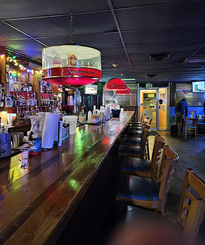 A bar that's seen it all but tells no tales. That worn wood has supported more elbows, stories, and cold drinks than anyone could count.