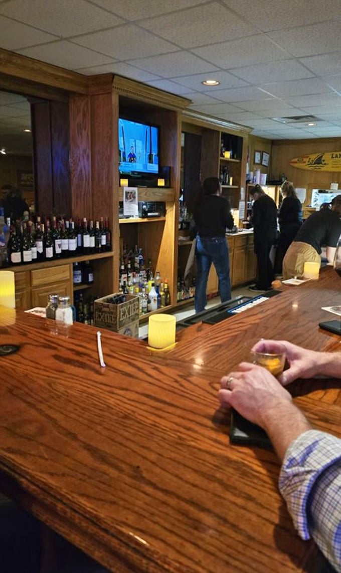 A well-stocked bar with wine selection shows this isn't just about beer and burgers, though those certainly shine.