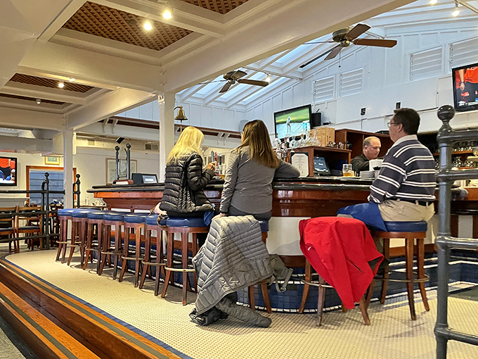 The bar area offers a casual alternative for solo diners or those who understand that sometimes the best conversations happen over drinks with strangers.
