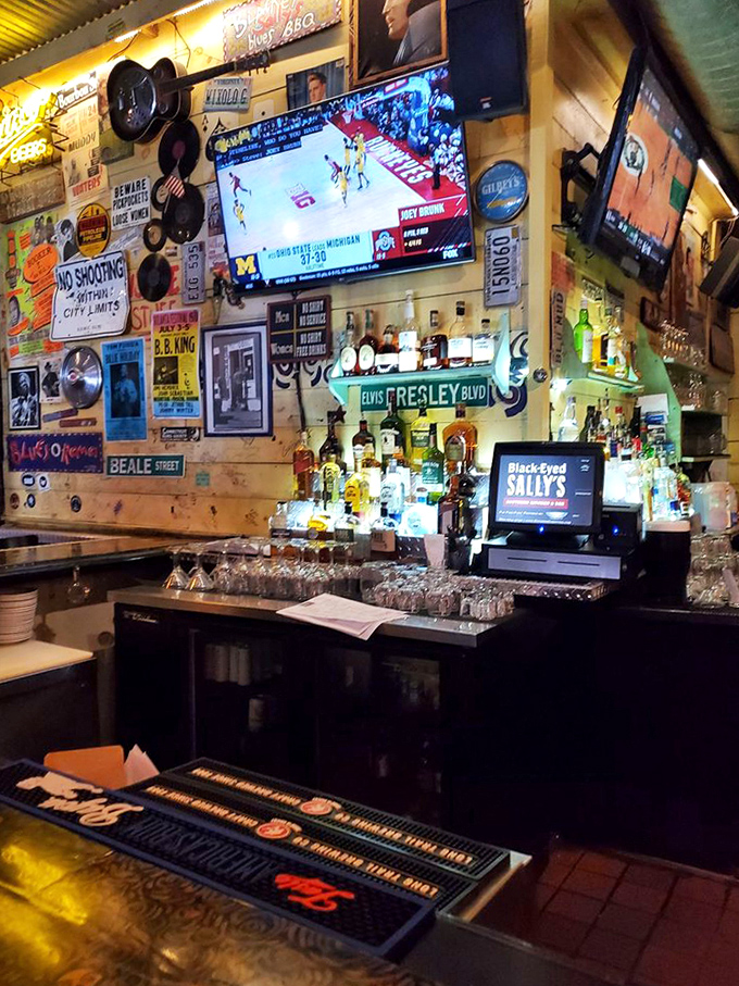 The bar wall tells stories of blues legends and Southern spirits – both the kind you drink and the kind that inspire the music.