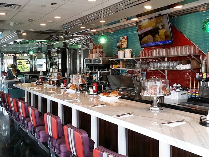 The counter where magic happens&mdash;gleaming surfaces, red accents, and the promise of coffee refills as far as the eye can see.