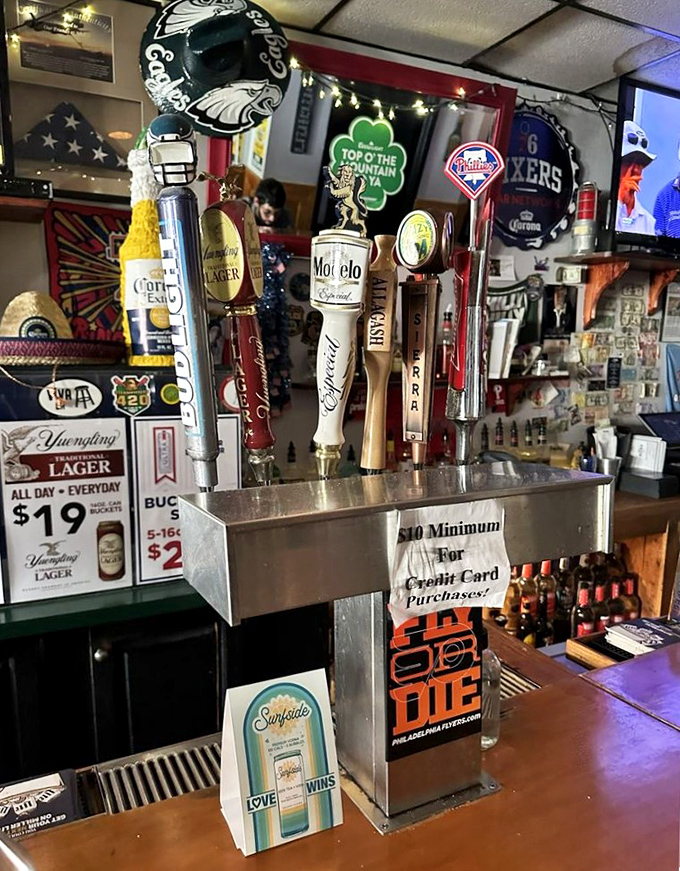Beer taps standing at attention like soldiers guarding liquid happiness. Philadelphia's finest brews await your command.