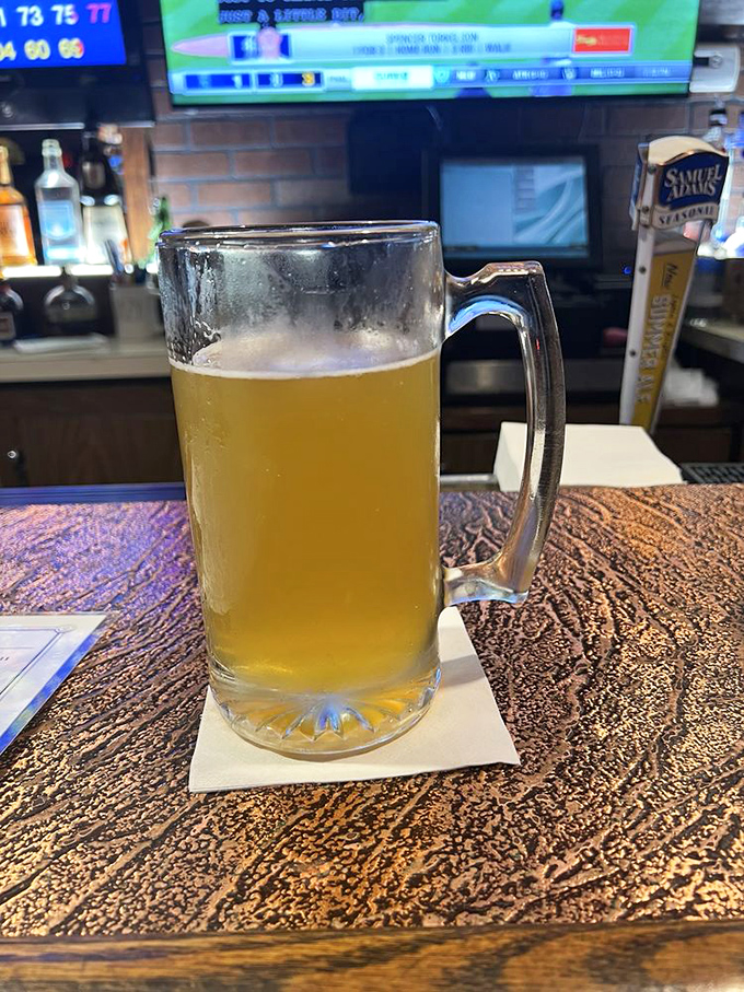 A frosty mug of golden happiness that proves sometimes the best wine pairing for great food is actually a perfectly poured beer.