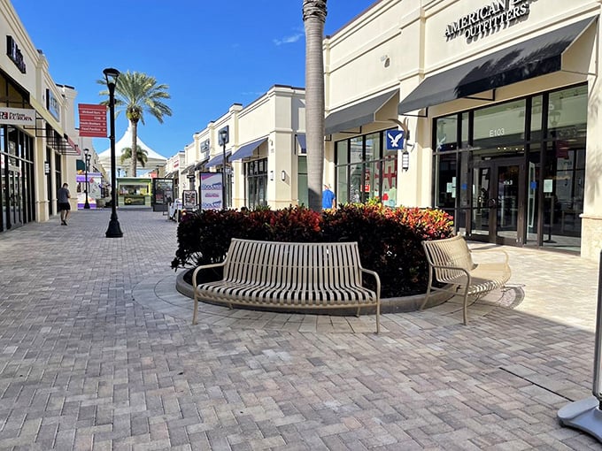 Strategically placed benches offer shoppers a moment to rest weary feet and contemplate their next retail conquest.