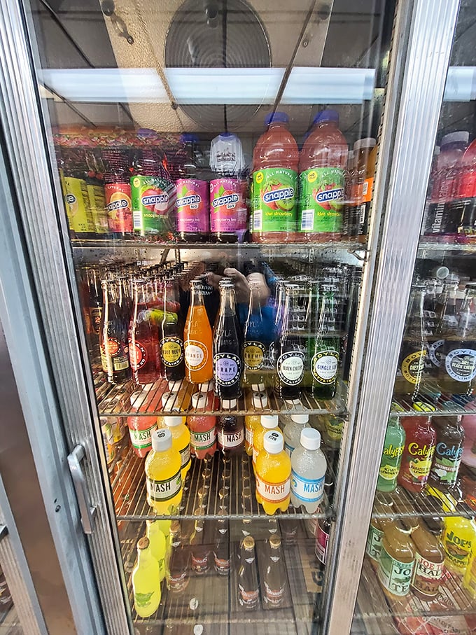 The drink cooler: where colorful bottles of liquid refreshment stand ready to help you tackle sandwich mountains.