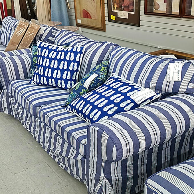 Nautical stripes and coordinating pillows make this couch set the kind of find that has decorators doing double-takes at the price tag.