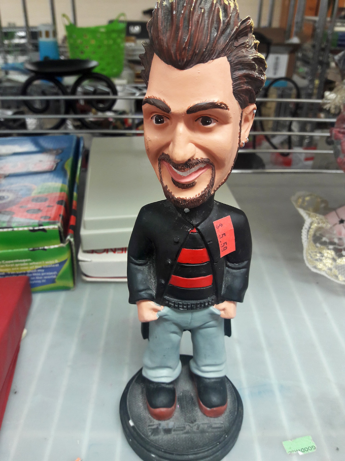 A bobblehead figure stands guard among the collectibles &ndash; proof that one person's quirky is another's treasure.