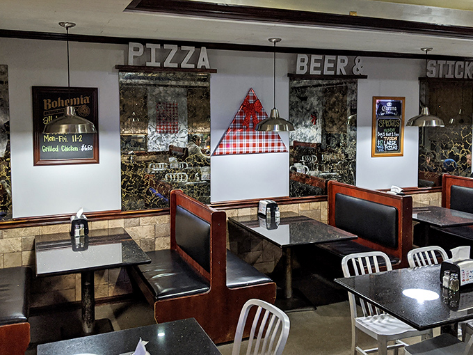 "Pizza, Beer & Sticks" - three simple words that sum up the meaning of life, at least while you're sitting in these cozy booths.