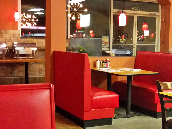 These fire-engine red booths have witnessed countless first dates, family celebrations, and solo diners lost in good books.