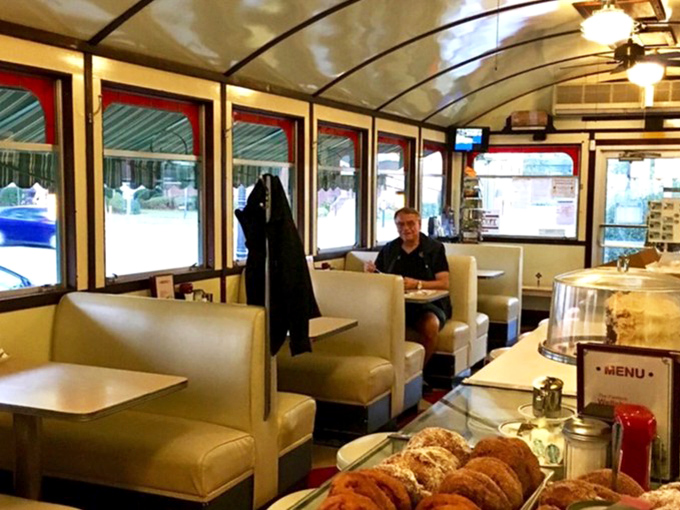 Cream-colored booths invite you to sink in and stay awhile, with windows framing Main Street like living paintings that change with the seasons.