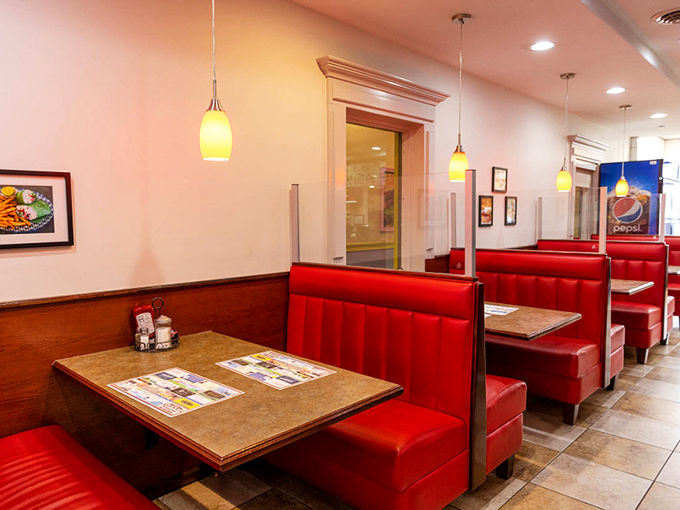 Classic diner booths in fire-engine red—the universal signal for "good comfort food served here." Some design languages are truly timeless.