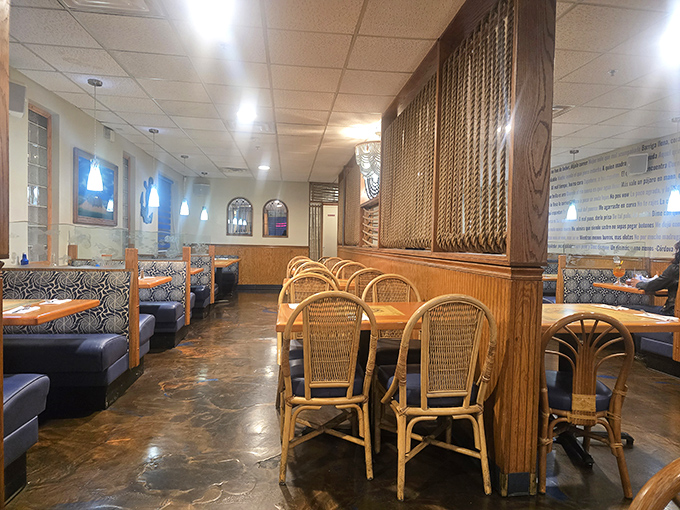 The dining room's warm wood tones and rattan chairs create an atmosphere that's part coastal cantina, part family dining room&mdash;comfortable in either role.