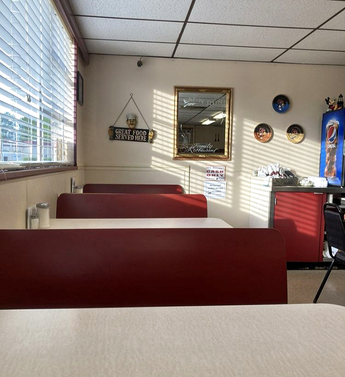 Red booths that have cradled countless conversations. The wall sign doesn't lie&mdash;great food is indeed served here, without fanfare or fuss. 