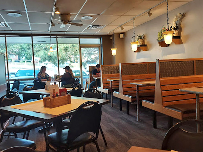 Wooden booths bathed in natural light create that perfect neighborhood restaurant vibe&mdash;familiar enough for regulars, welcoming enough for first-timers.