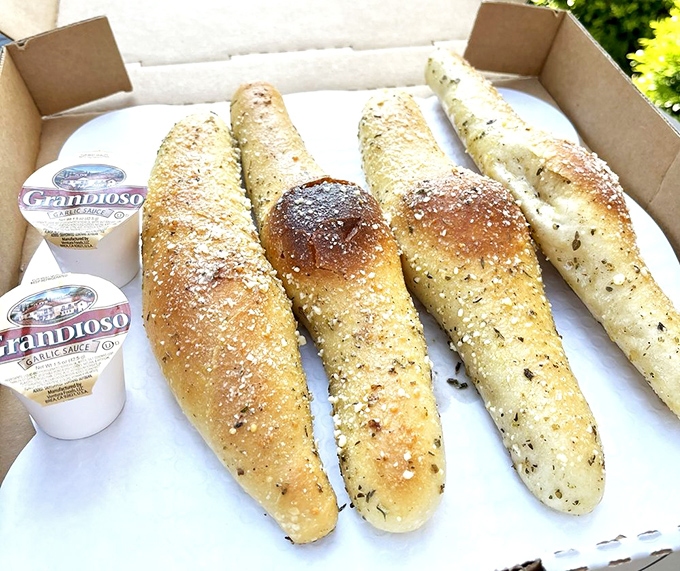 These breadsticks aren't just appetizers, they're a preview of coming attractions &ndash; golden, herb-flecked wands of pure carb magic.